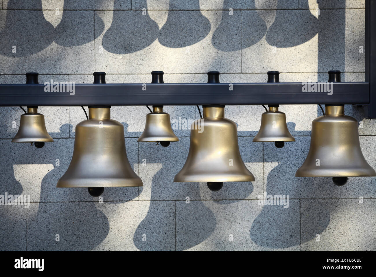 Color image of some various sized bells in a row Stock Photo - Alamy