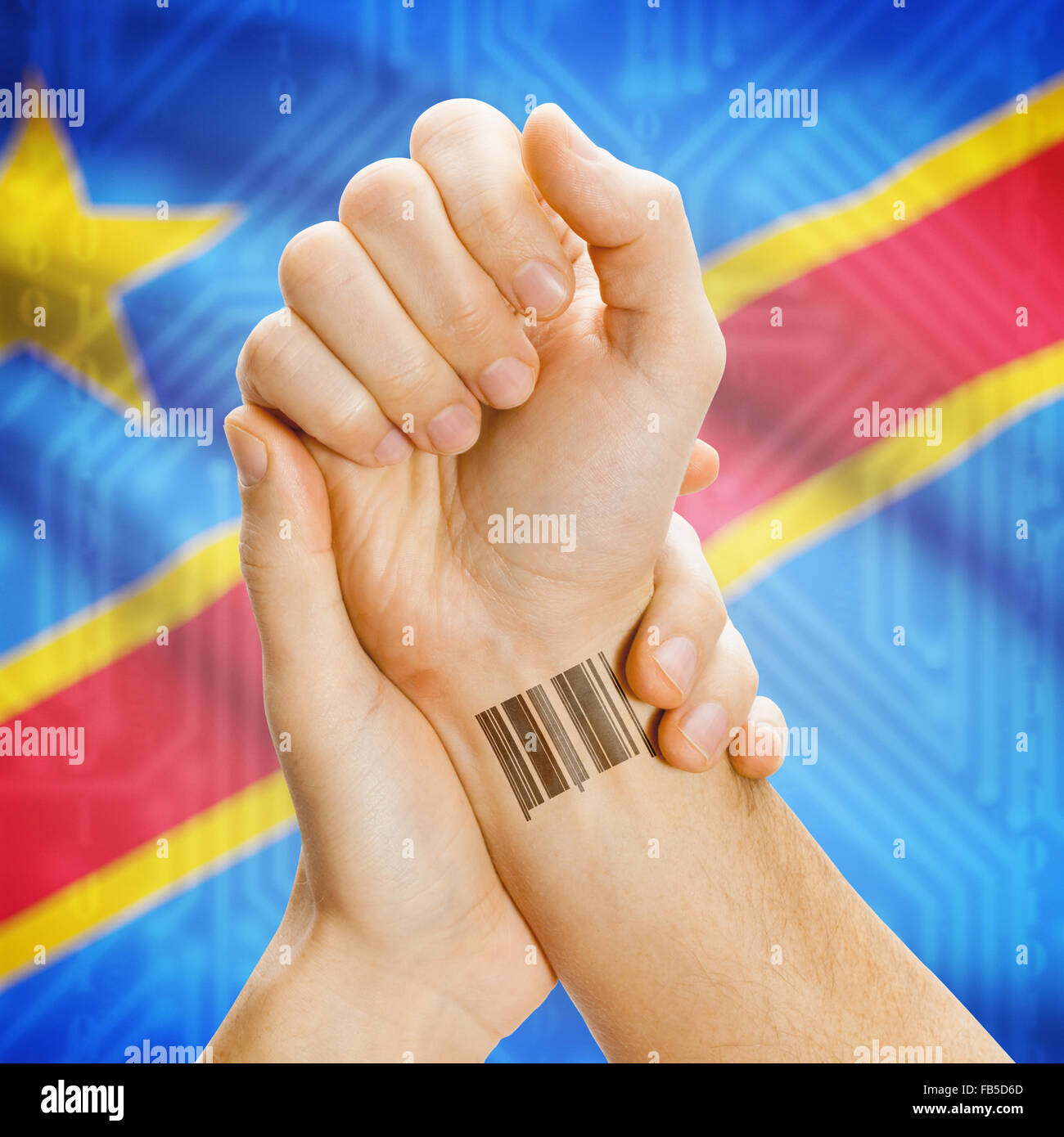 Barcode ID number on wrist of a human and national flag on background ...