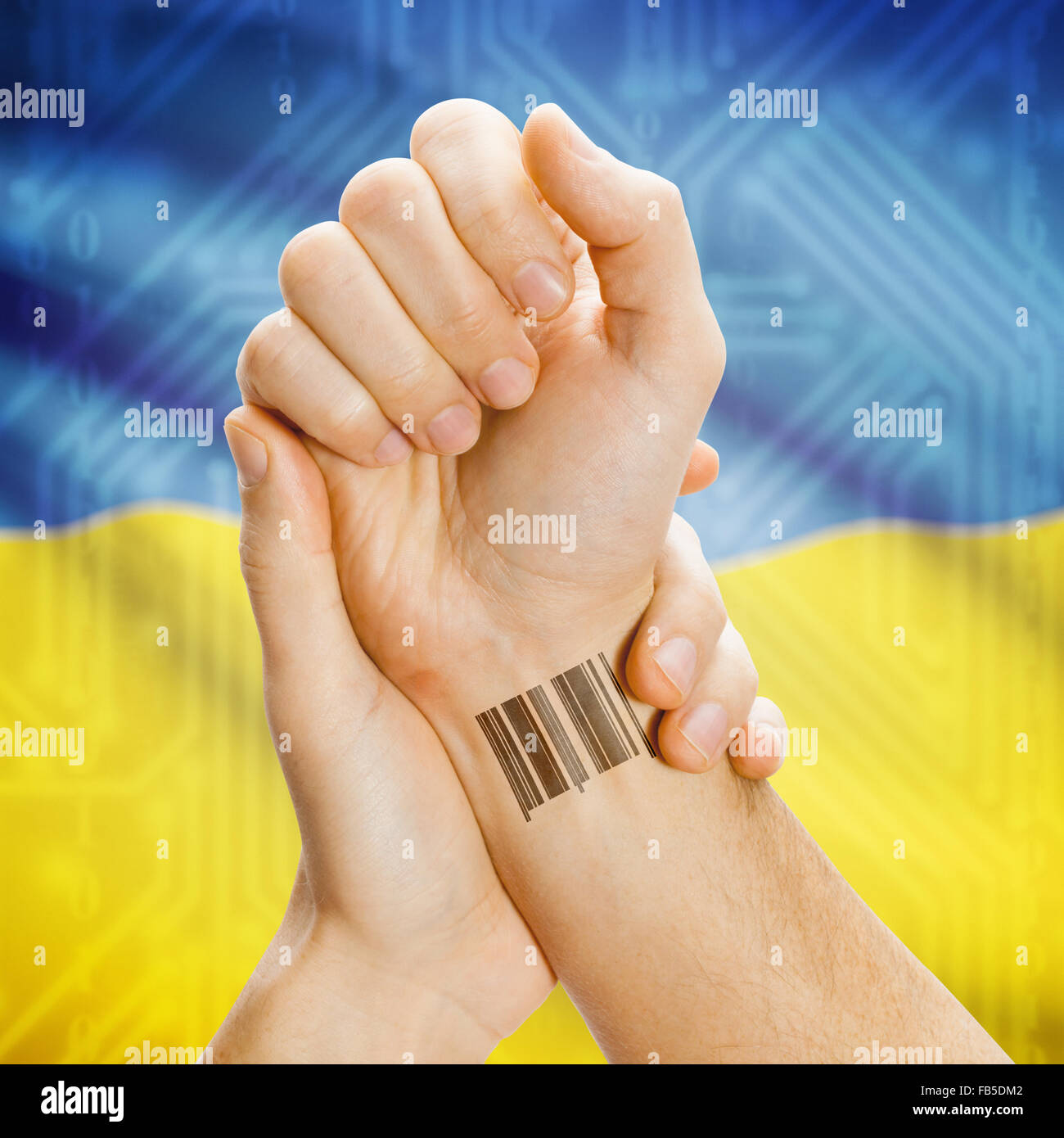 Barcode ID number on wrist of a human and national flag on background ...