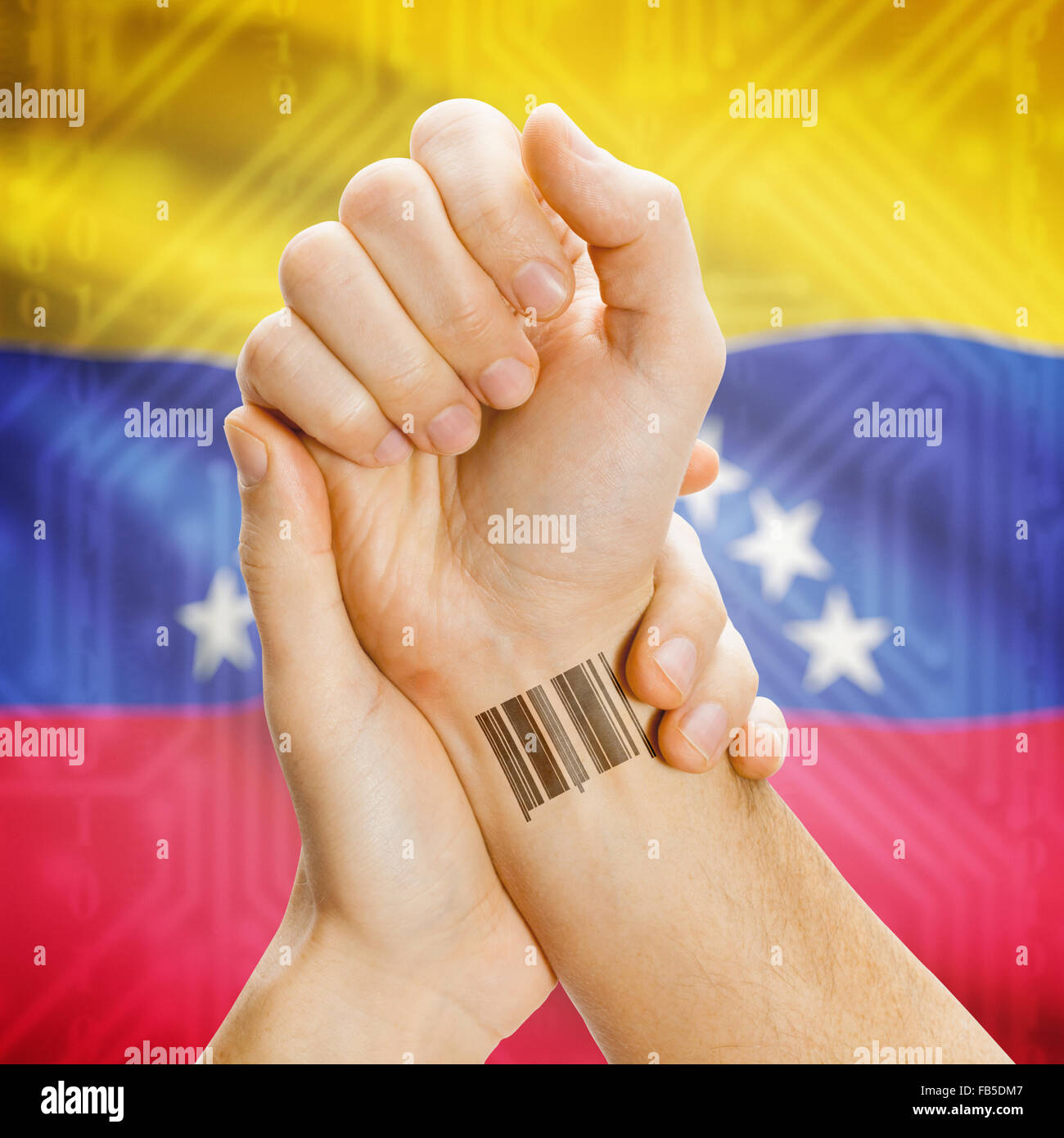 Barcode ID number on wrist of a human and national flag on background ...