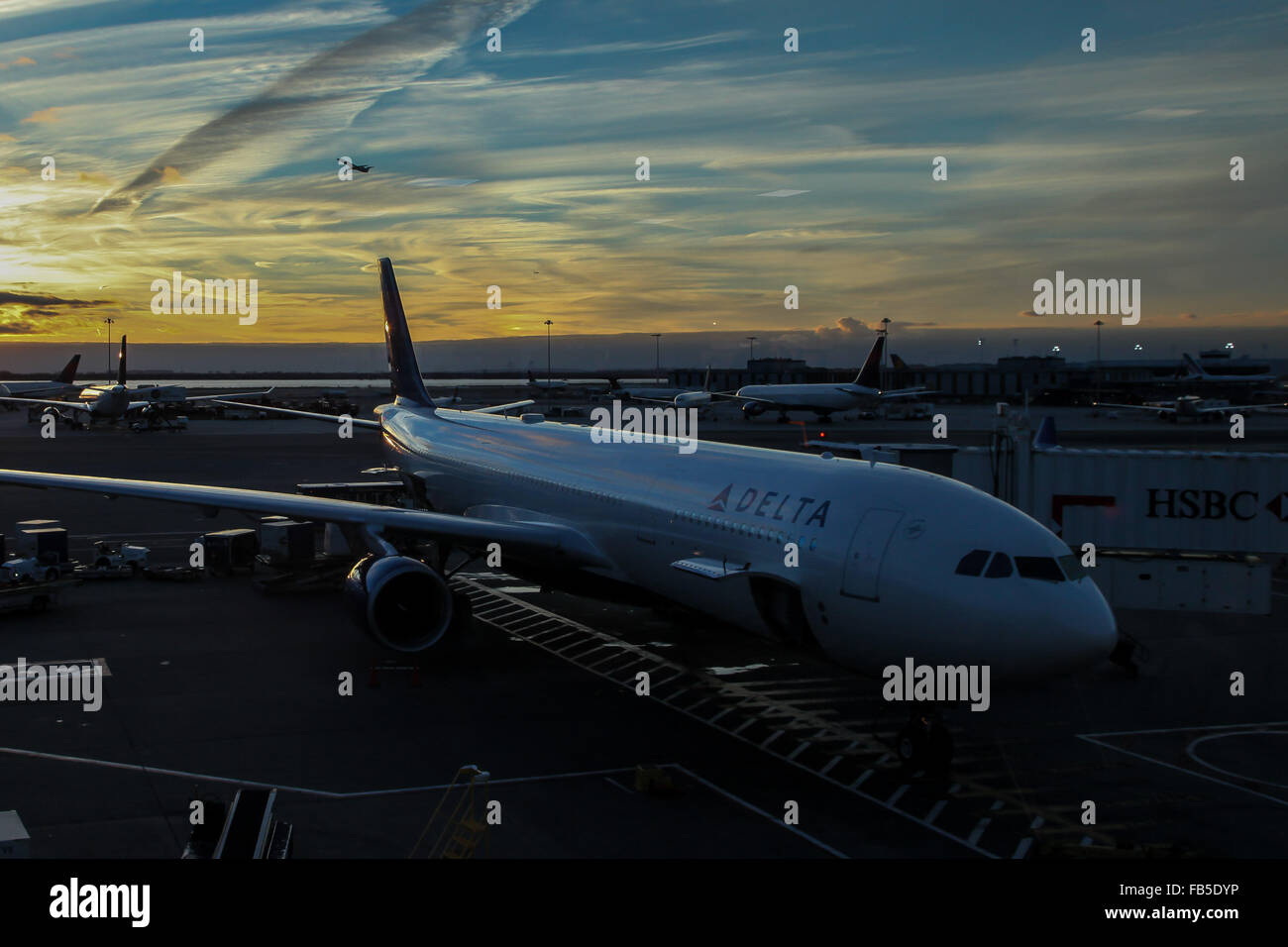 JFK International Airport sunset with Delta airplane on front, seen in ...