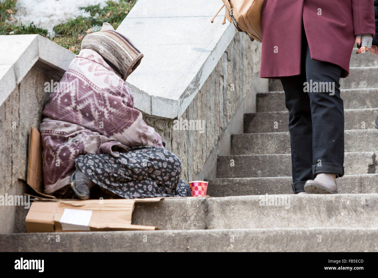 A homeless gypsy woman is begging for money in the center of Bulgaria's ...