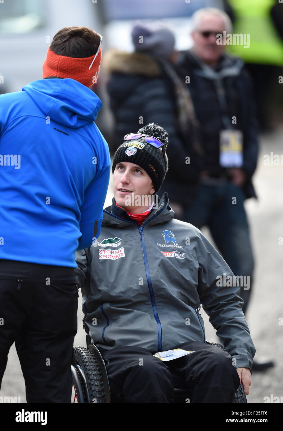 Former US ski jumper Nick Fairall (R) makes his way across the base ...