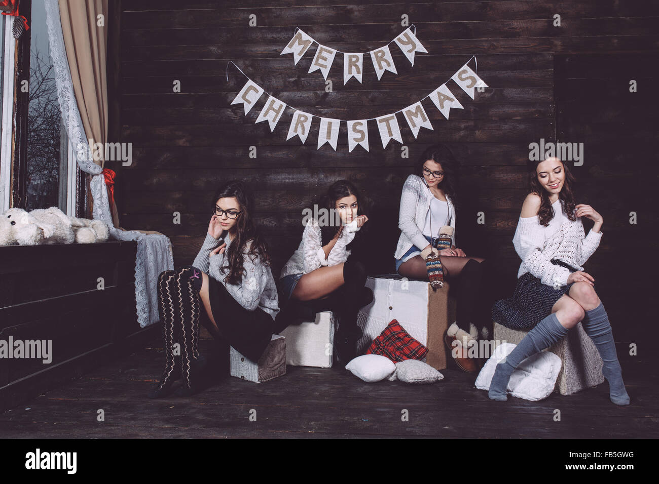 Four charming model posing Stock Photo - Alamy