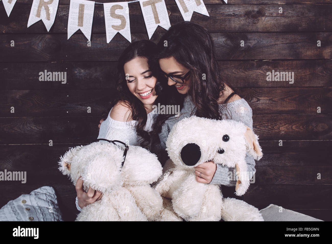 Two charming girls playing Stock Photo - Alamy