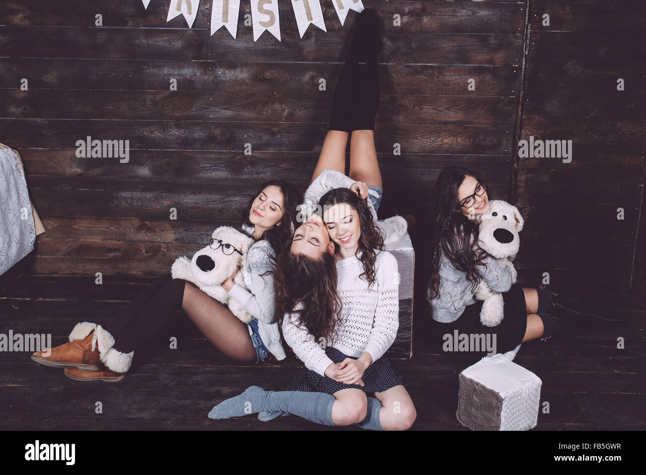 Four charming model posing Stock Photo - Alamy