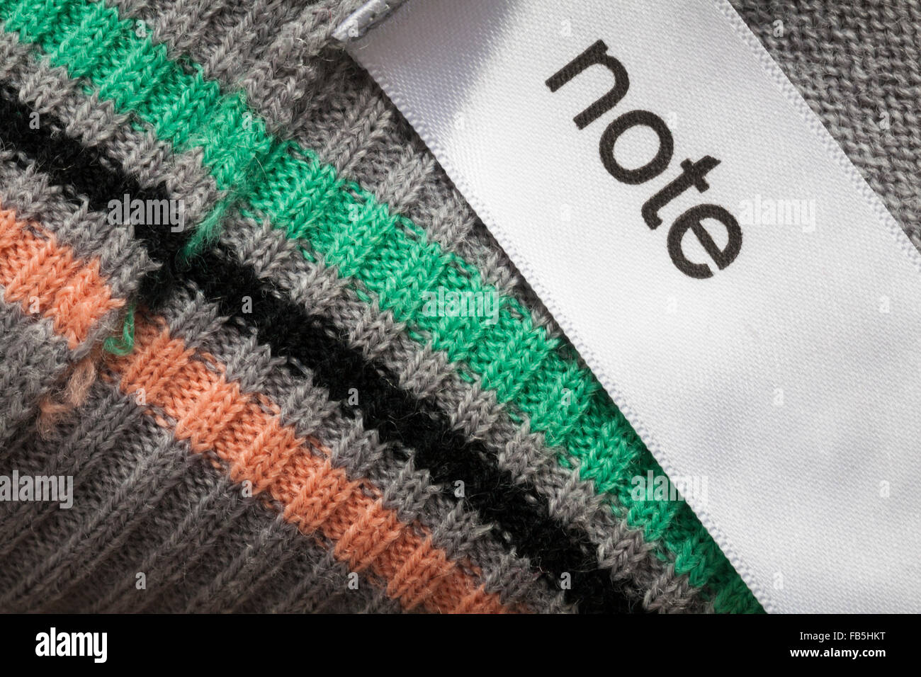 note label in grey marl jumper from JD Williams & Co Ltd Stock Photo ...