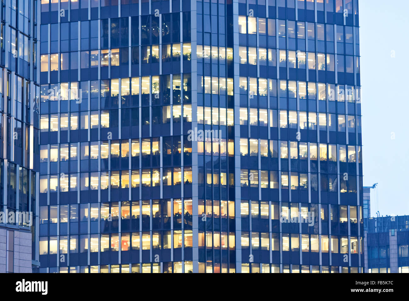 Office building with lights Stock Photo - Alamy
