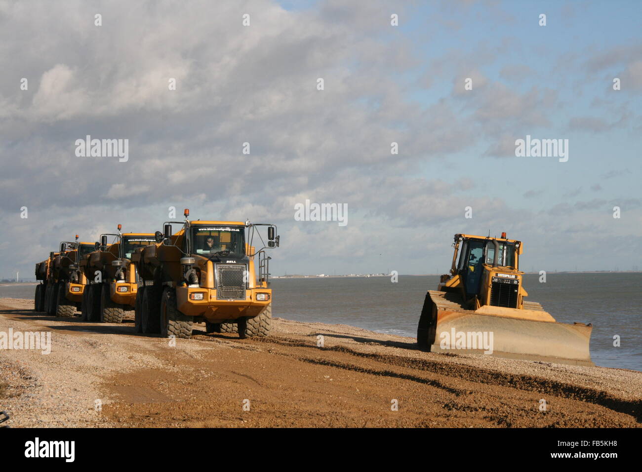 SEA DEFENCE WORKS FOR ENVIRONMENT AGENCY WITH A VIEW OF MONSTER TRUCKS ...