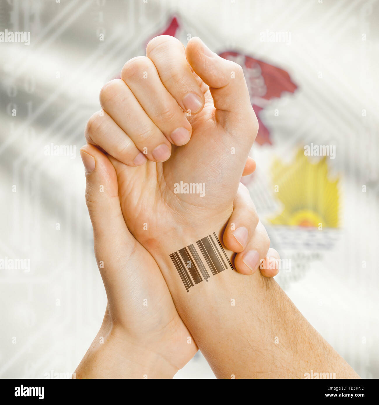 Barcode ID number tatoo on wrist and USA statesl flag on background ...