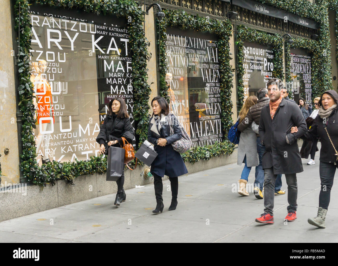 Shoppers outside of the Saks Fifth Avenue flagship store in New York on ...