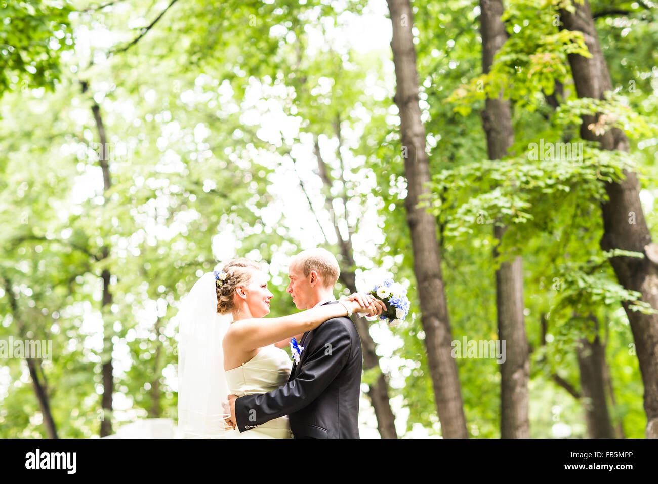 wedding couple hugging Stock Photo - Alamy