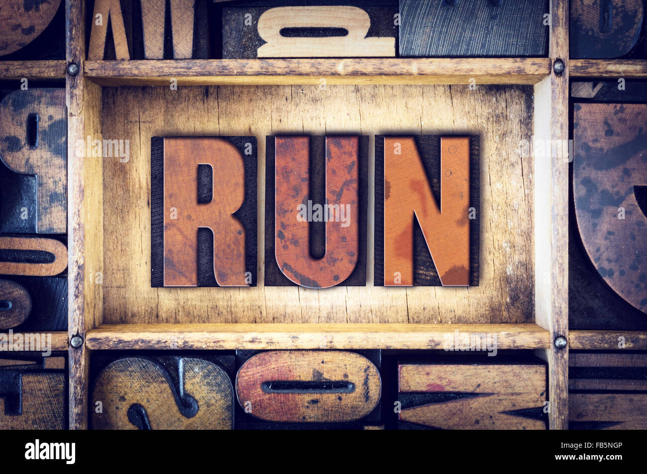 The word "Run" written in vintage wooden letterpress type Stock Photo ...