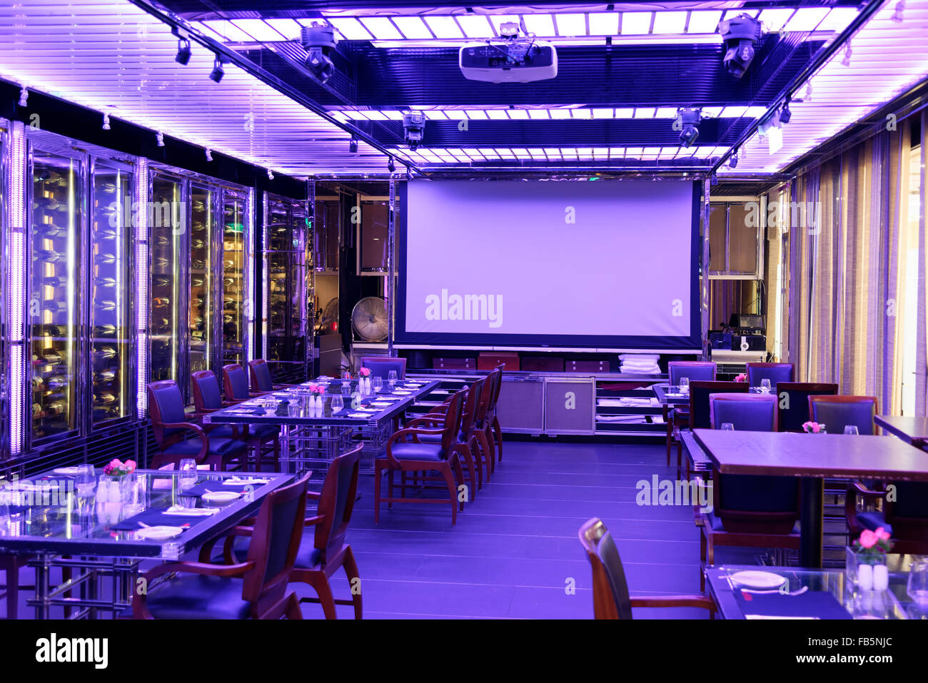 Conference and banquet room with projector and white screen Stock Photo ...