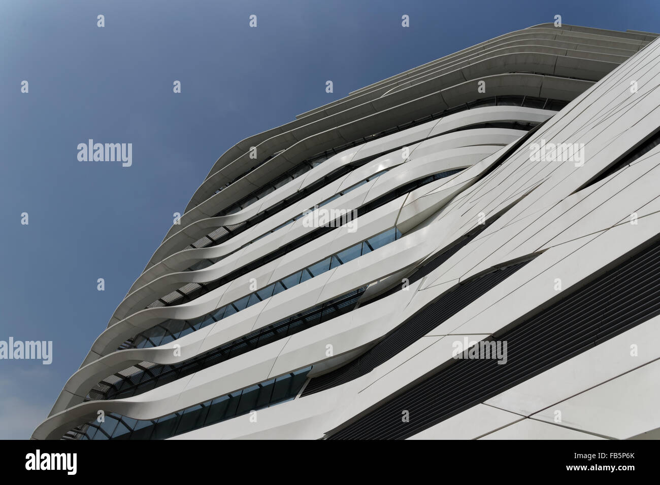 Futuristic skyscraper in a cruise ship design Stock Photo - Alamy