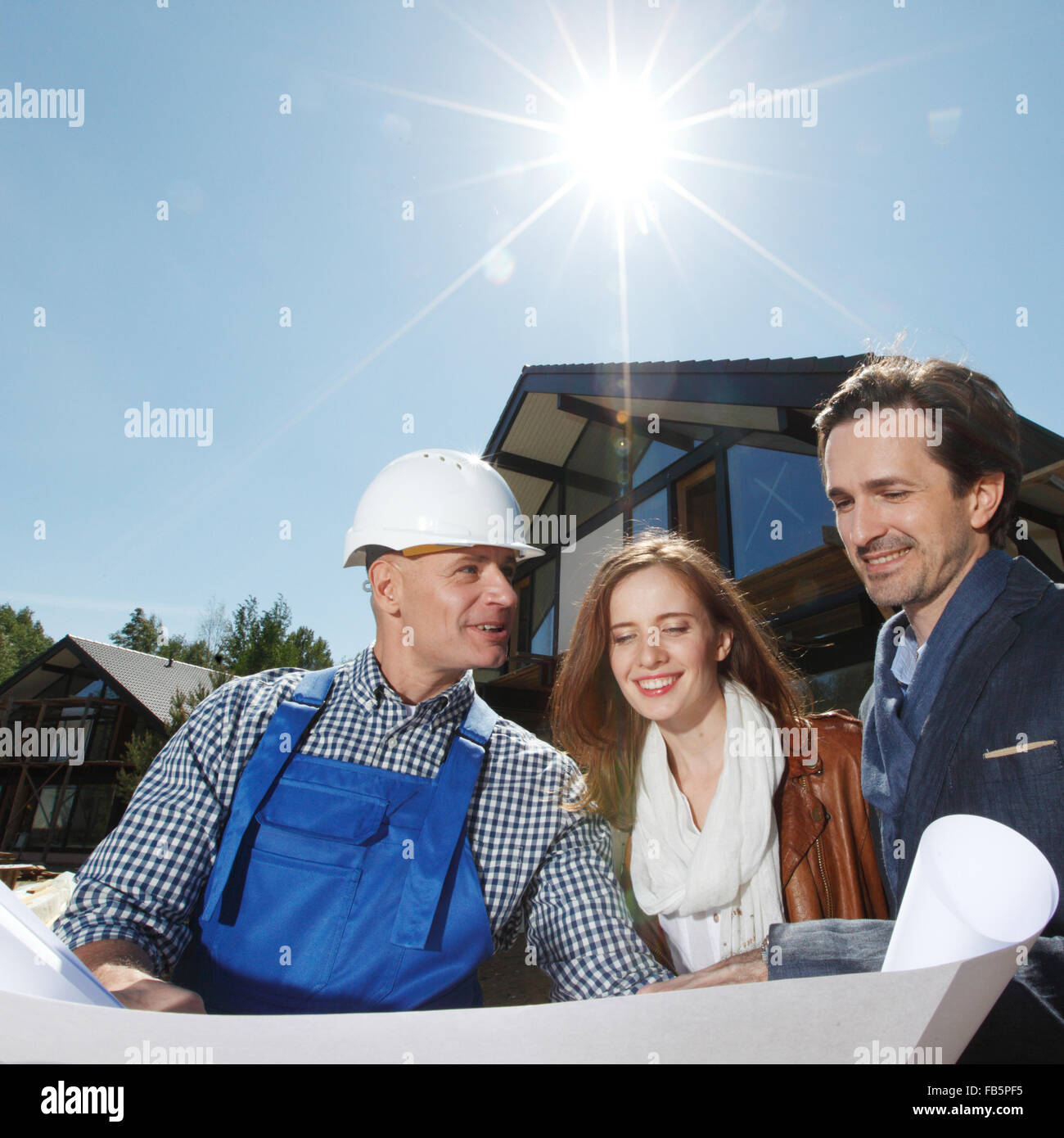 Worker holding house plan hi-res stock photography and images - Alamy