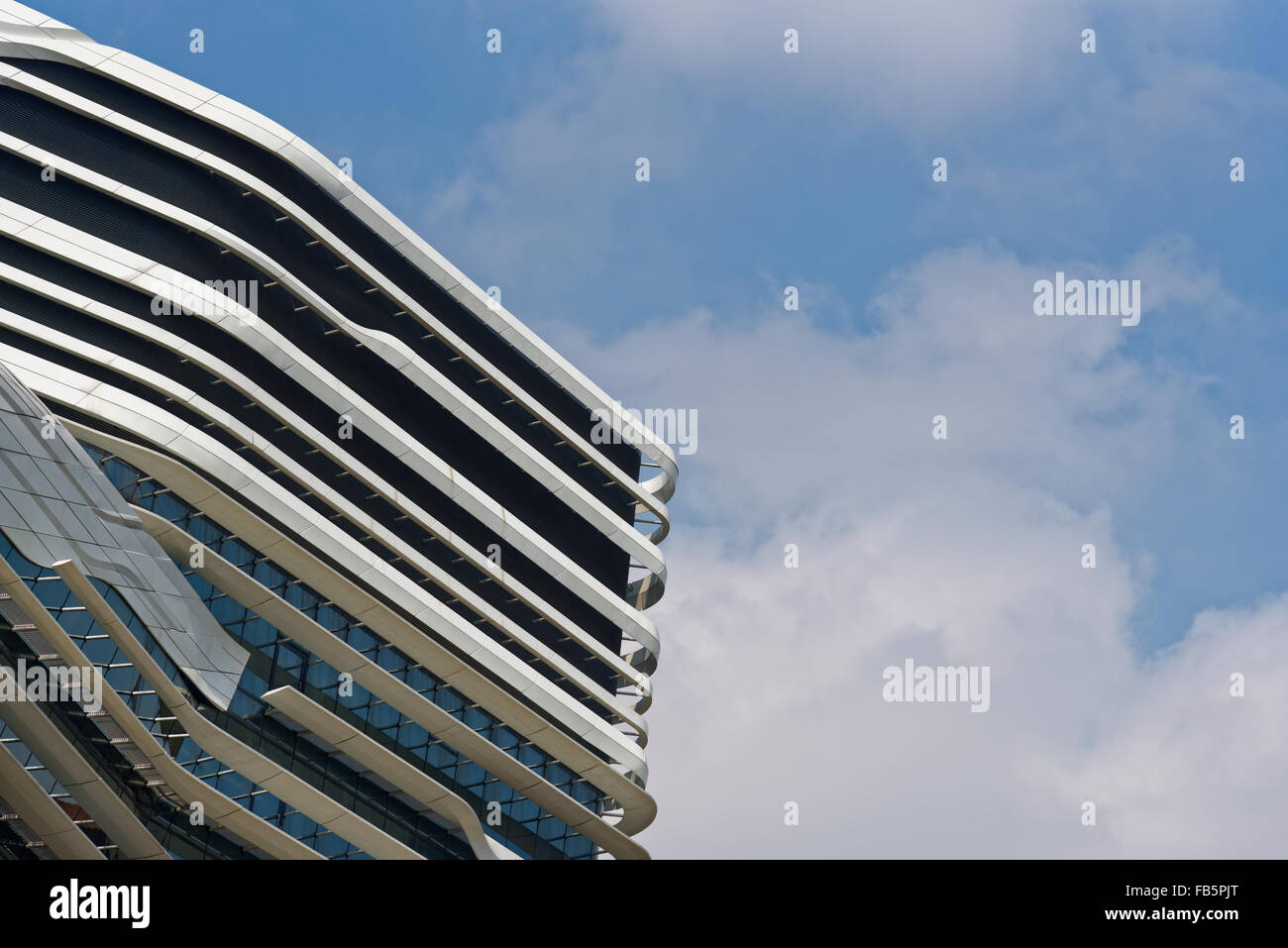 Futuristic skyscraper in a cruise ship design Stock Photo - Alamy