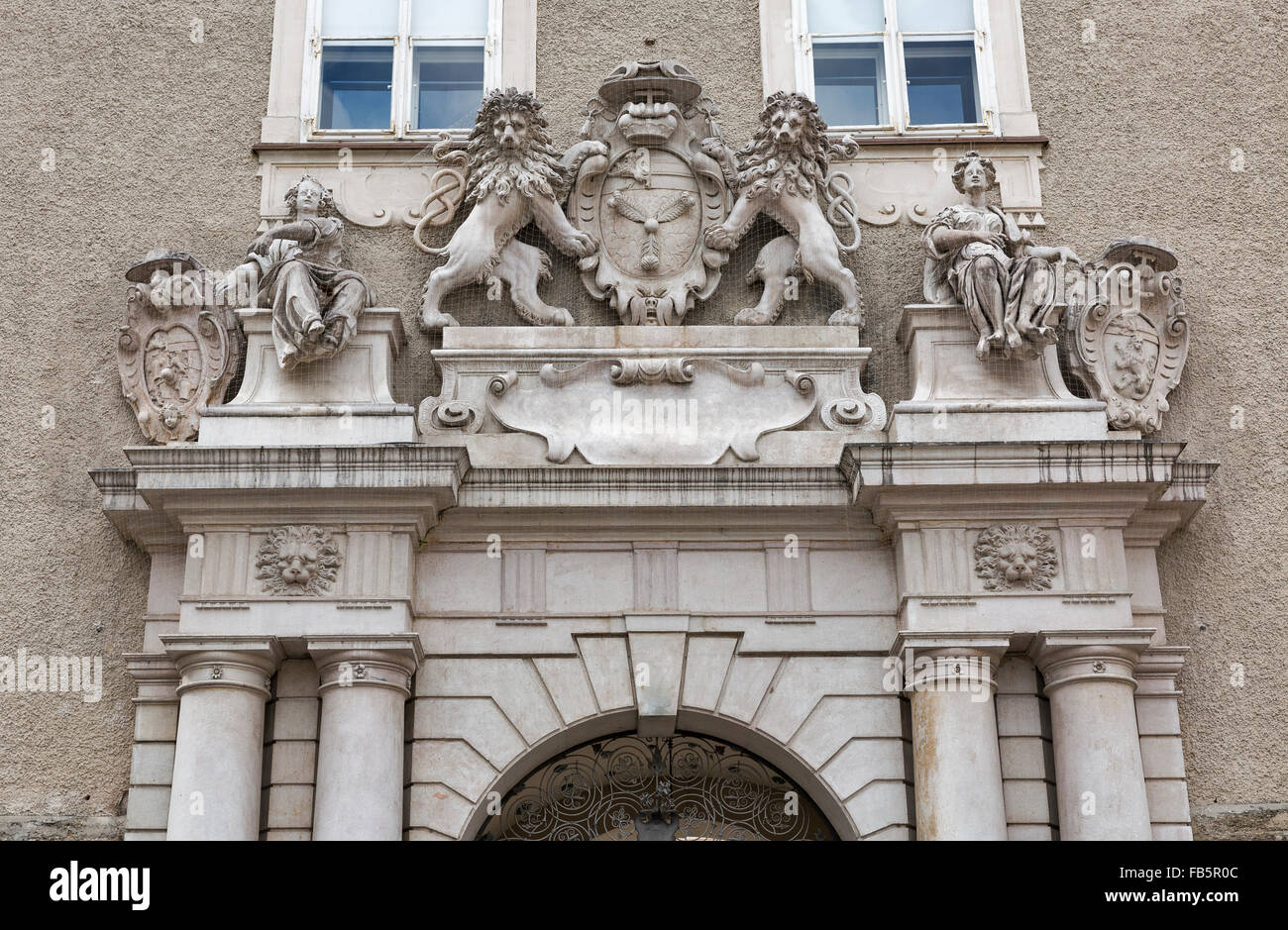 Sculpture composition with ancient Coat of Arms on the wall over gate ...