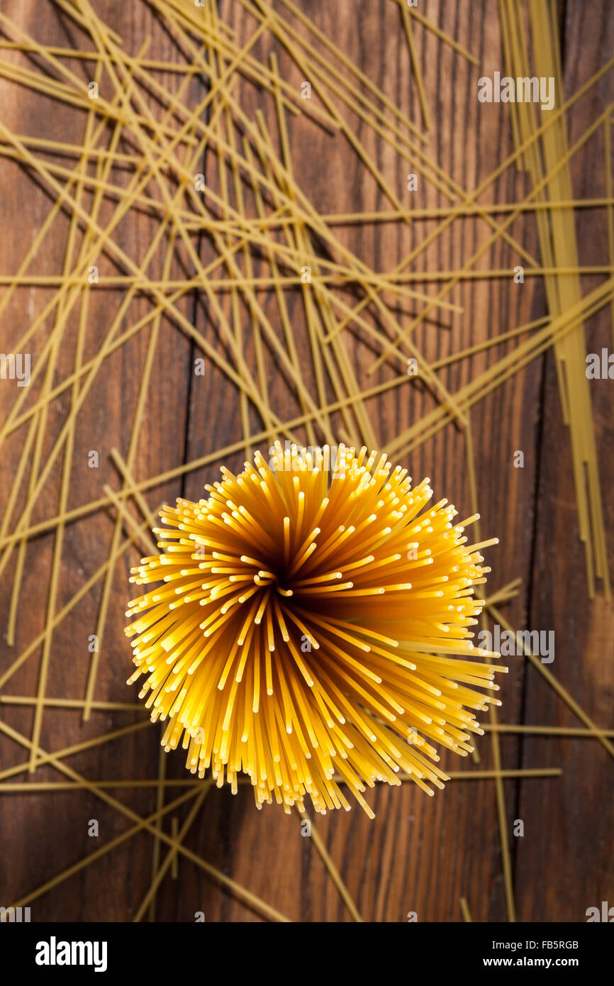italian spaghetti on wooden background. Top view Stock Photo - Alamy