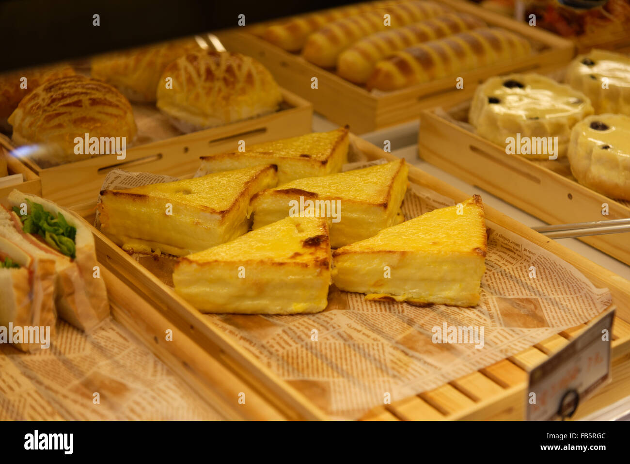 Baked egg bread sandwich on a shop shelf in a wooden box Stock Photo ...