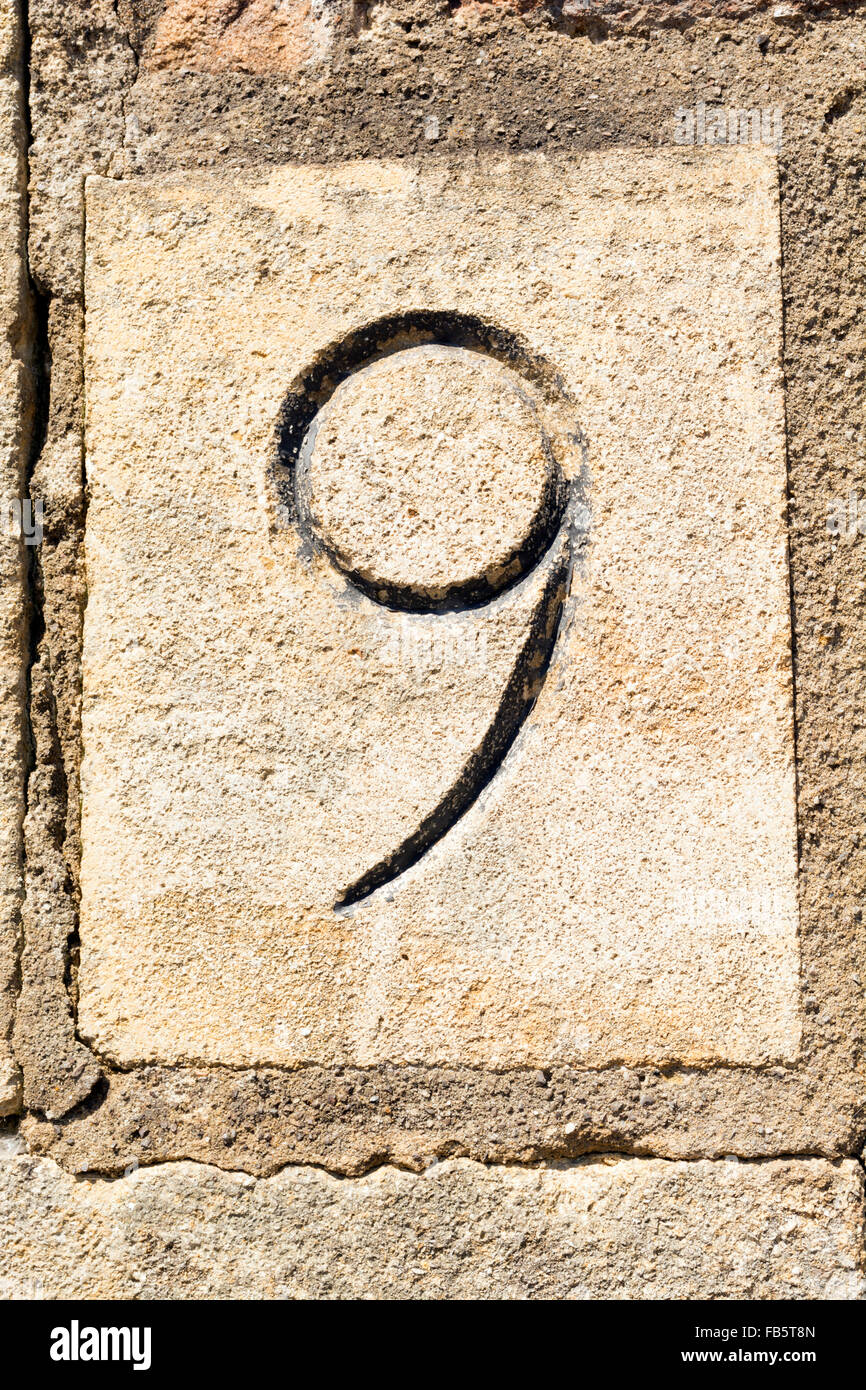 The number 9 carved in a block of stone carved outside of The Diocese ...