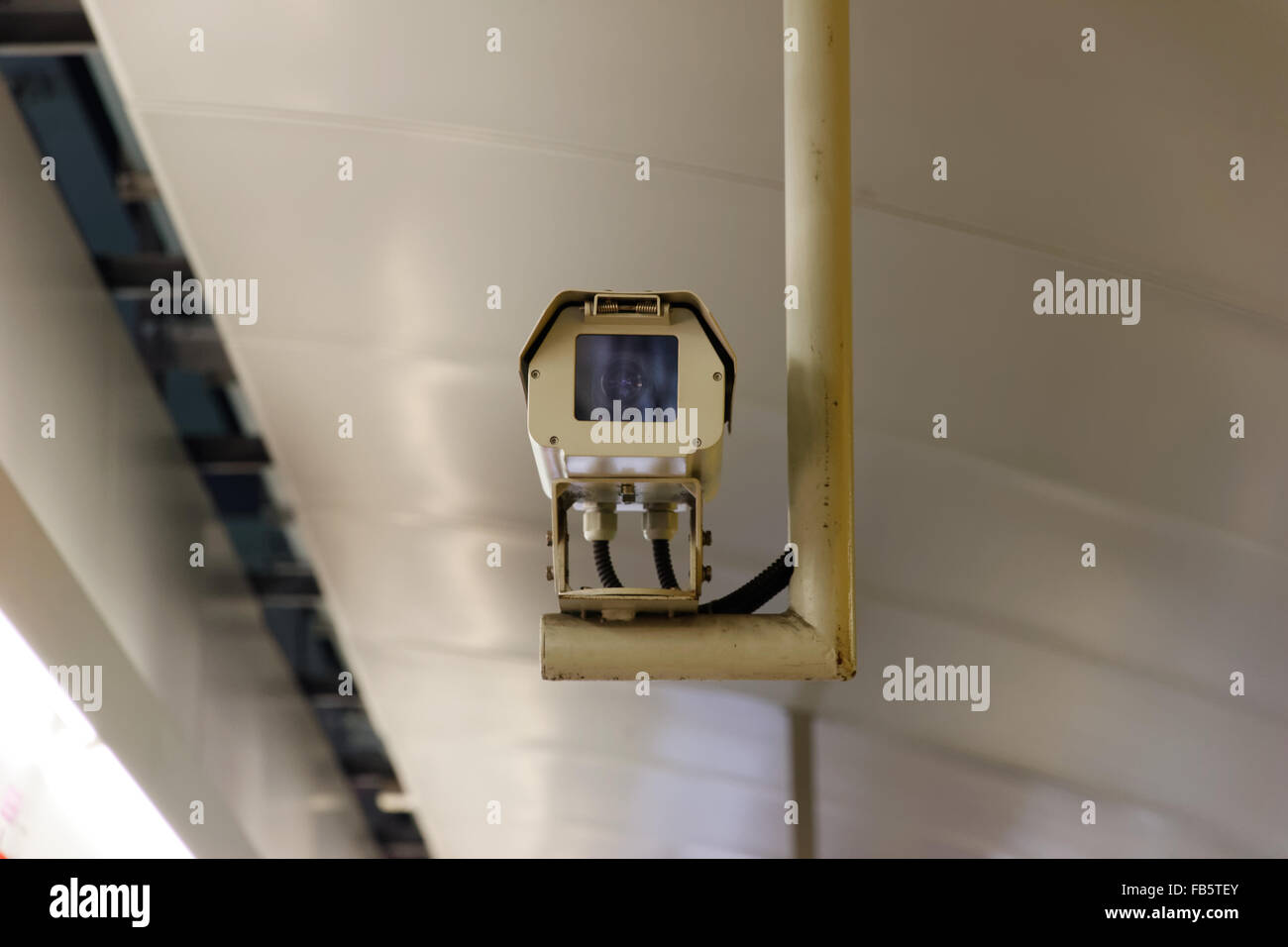 Surveillance camera looking at you Stock Photo - Alamy