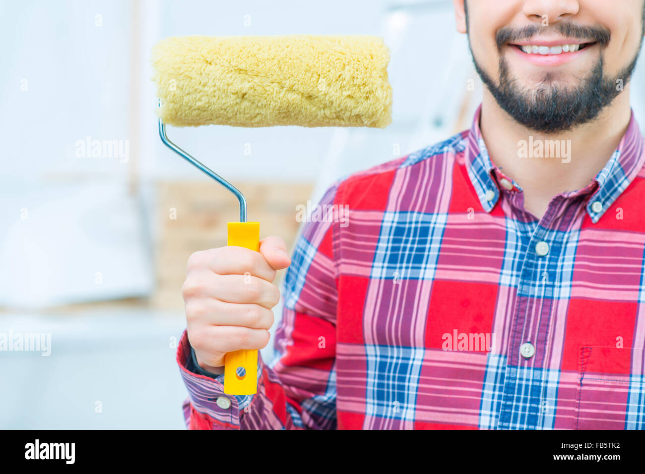 Handsome man doing renovation Stock Photo - Alamy