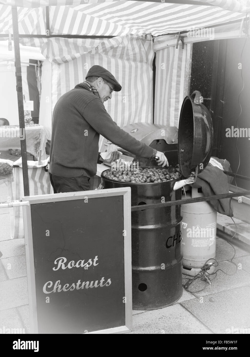 Market seller roasting chestnuts hi-res stock photography and images ...