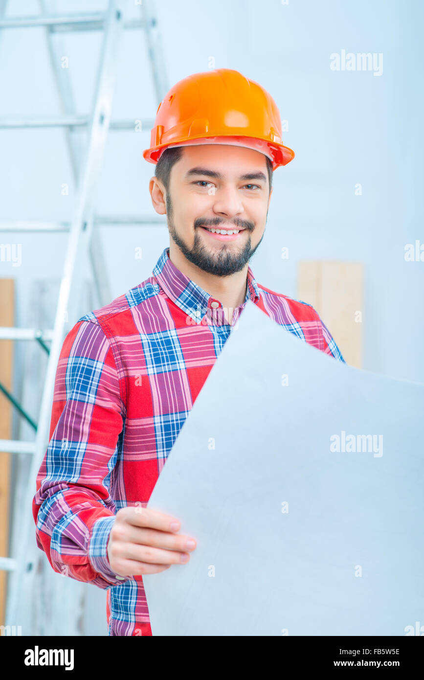 Handsome man doing renovation Stock Photo - Alamy