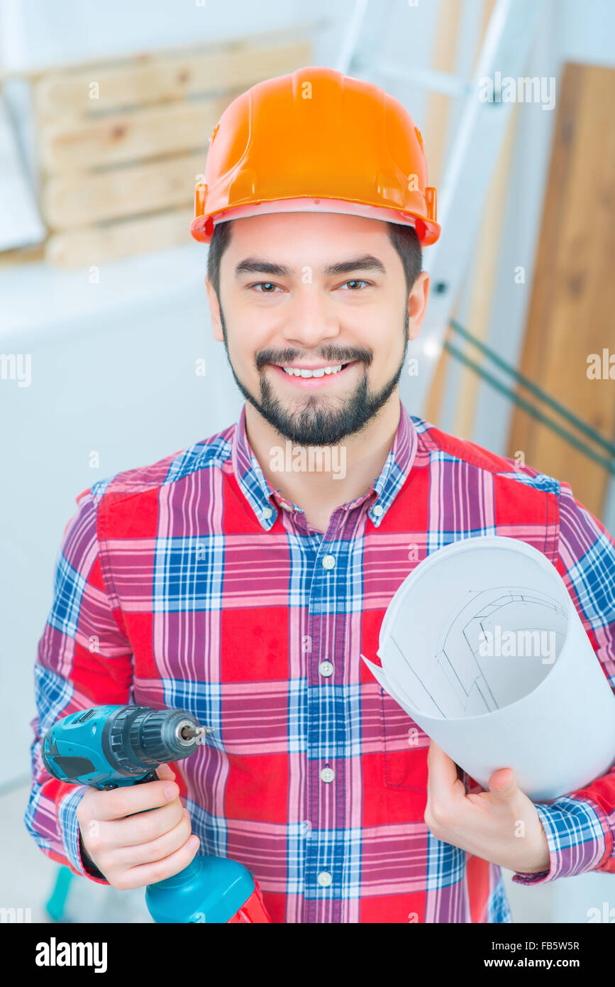 Handsome man doing renovation Stock Photo - Alamy