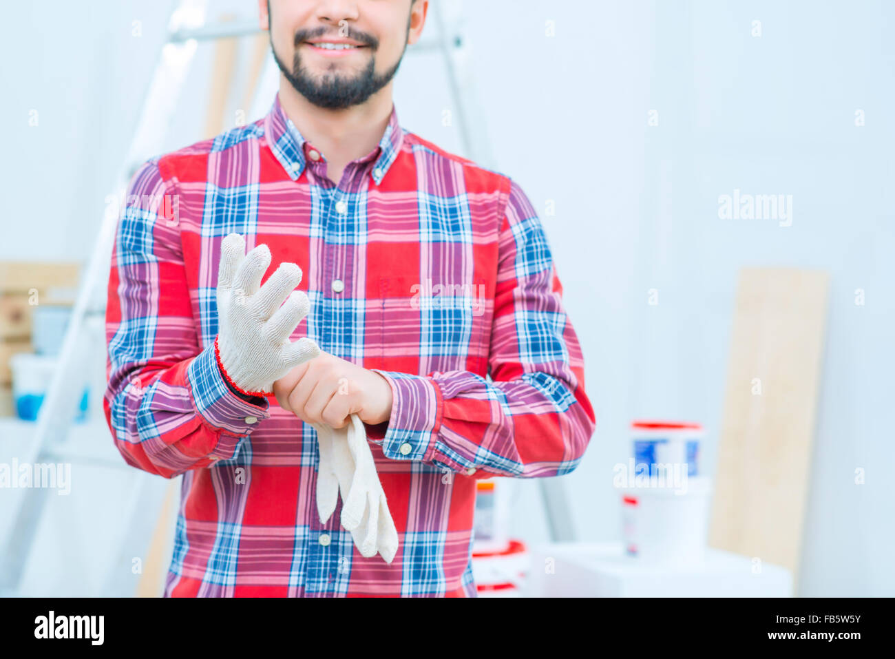 Handsome man doing renovation Stock Photo - Alamy