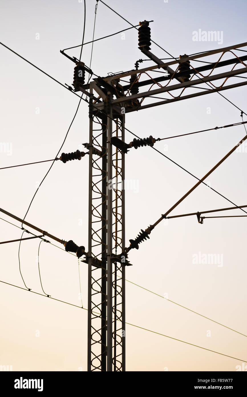 Railroad power transmission line tower during sunset Stock Photo - Alamy
