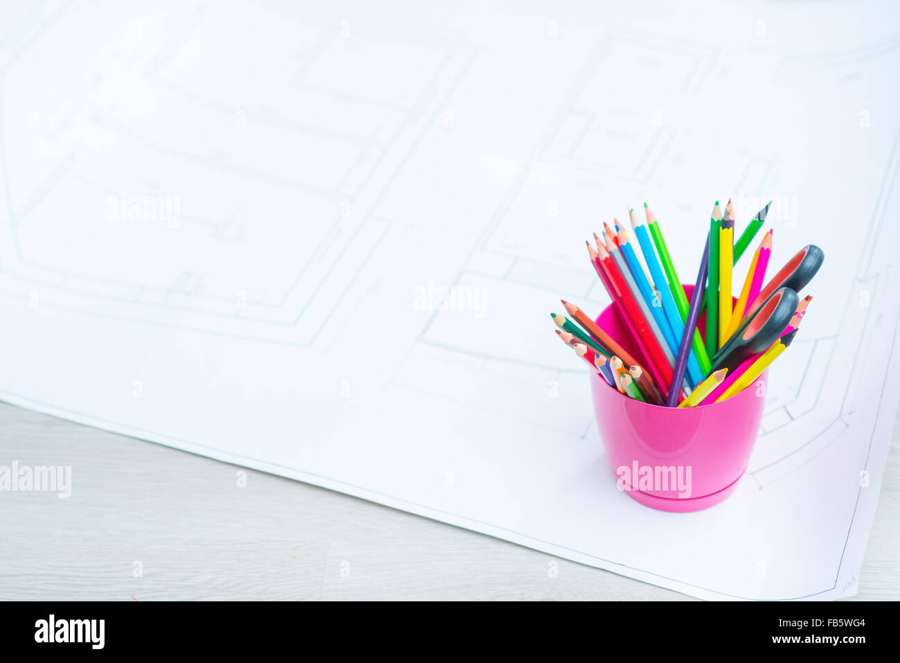 Color pencils standing on the floor Stock Photo - Alamy
