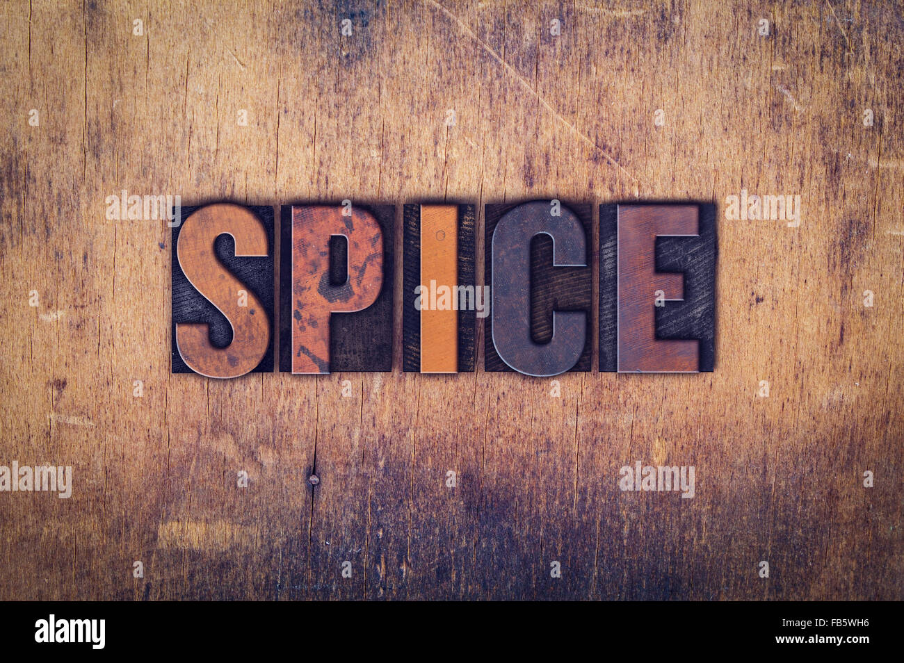 The word "Spice" written in dirty vintage letterpress type on a aged ...