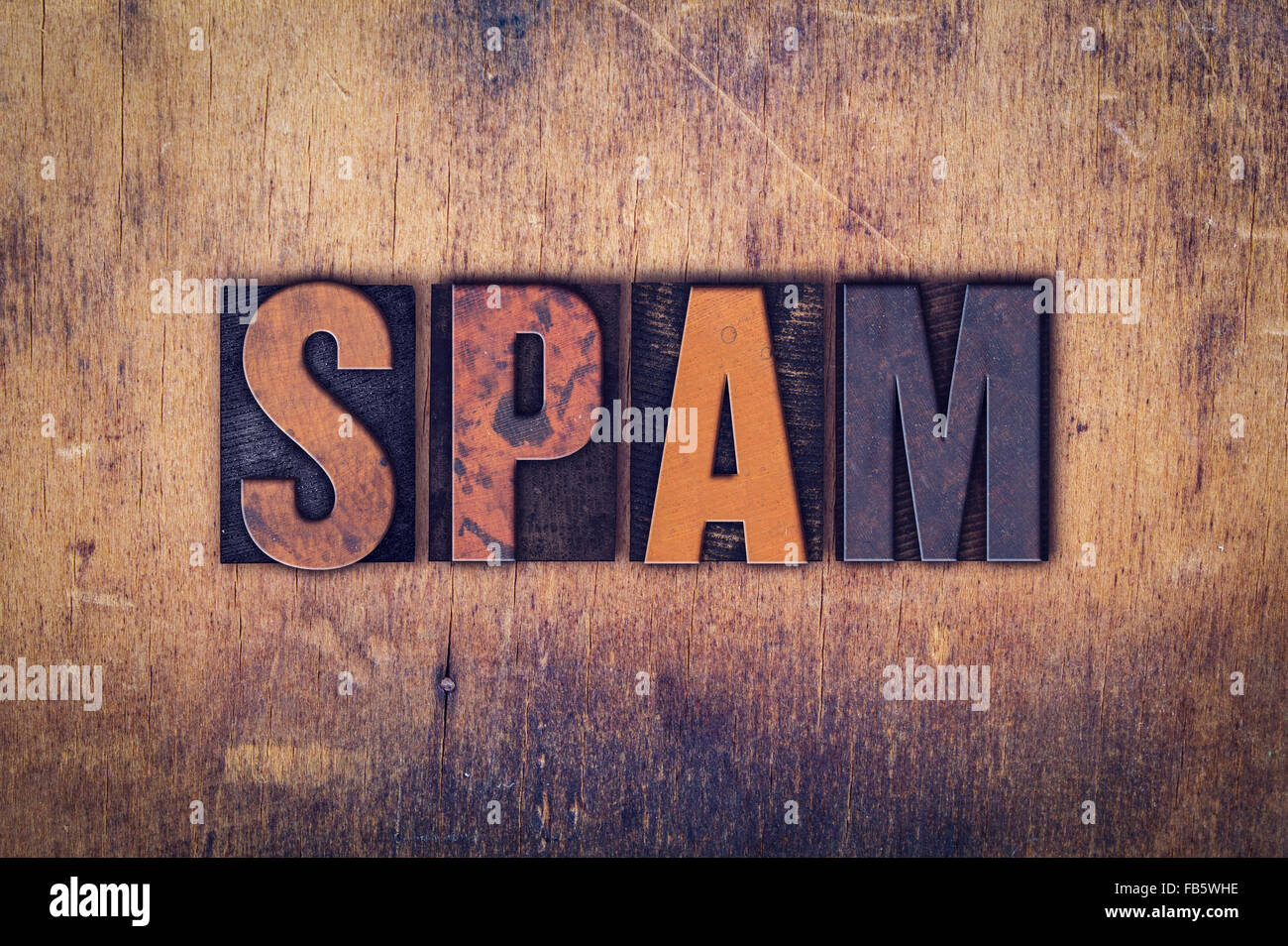 The word "Spam" written in dirty vintage letterpress type on a aged ...