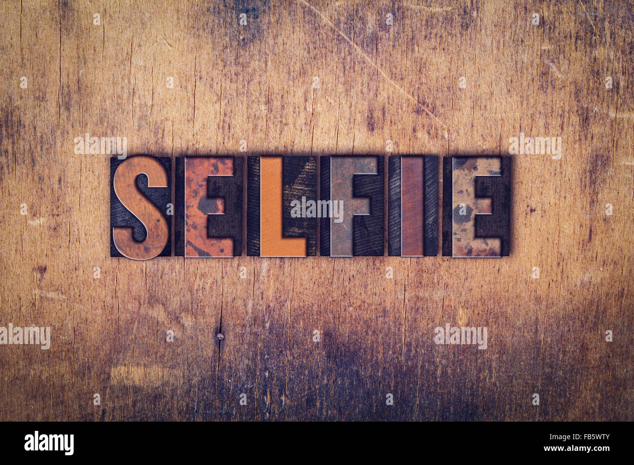 The word "Selfie" written in dirty vintage letterpress type on a aged ...