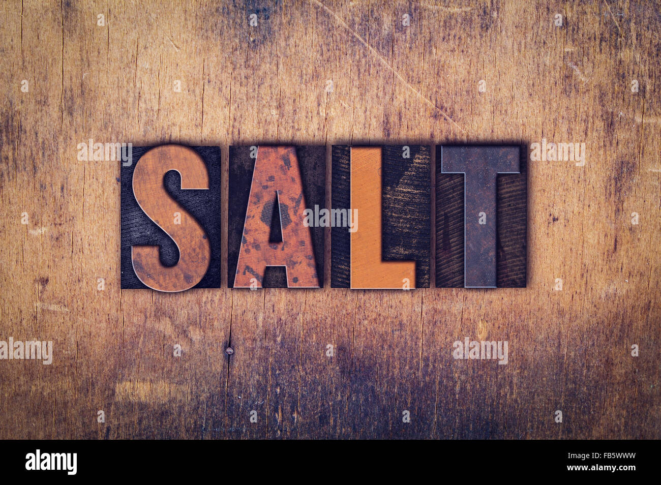 The word "Salt" written in dirty vintage letterpress type on a aged ...