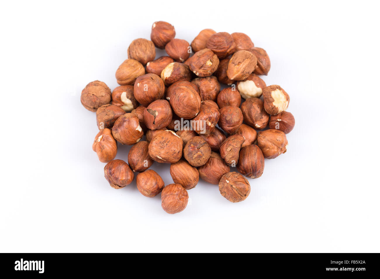 Heap of hazelnuts isolated on white background, macro image Stock Photo ...