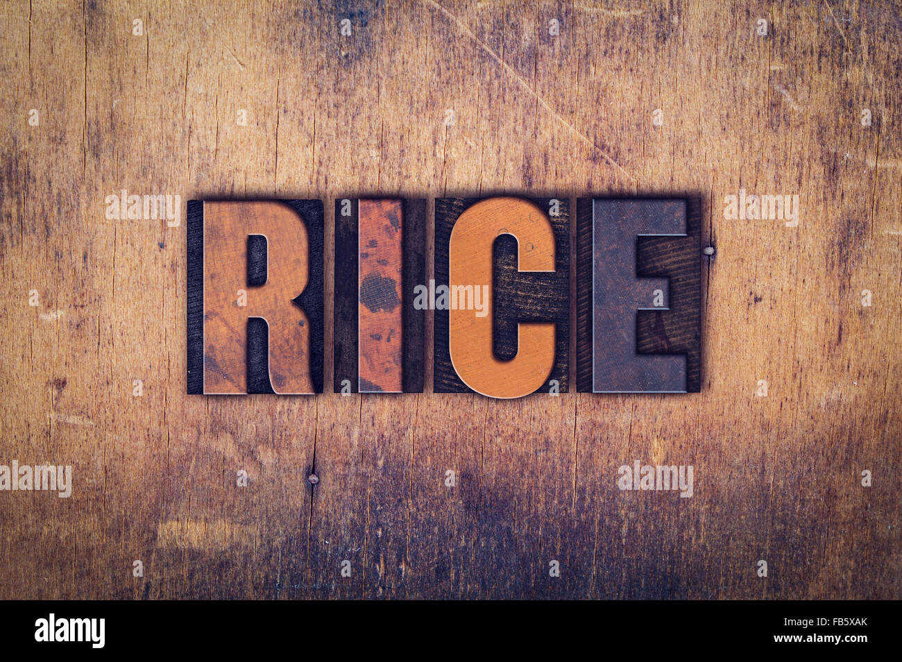 The word "Rice" written in dirty vintage letterpress type on a aged ...