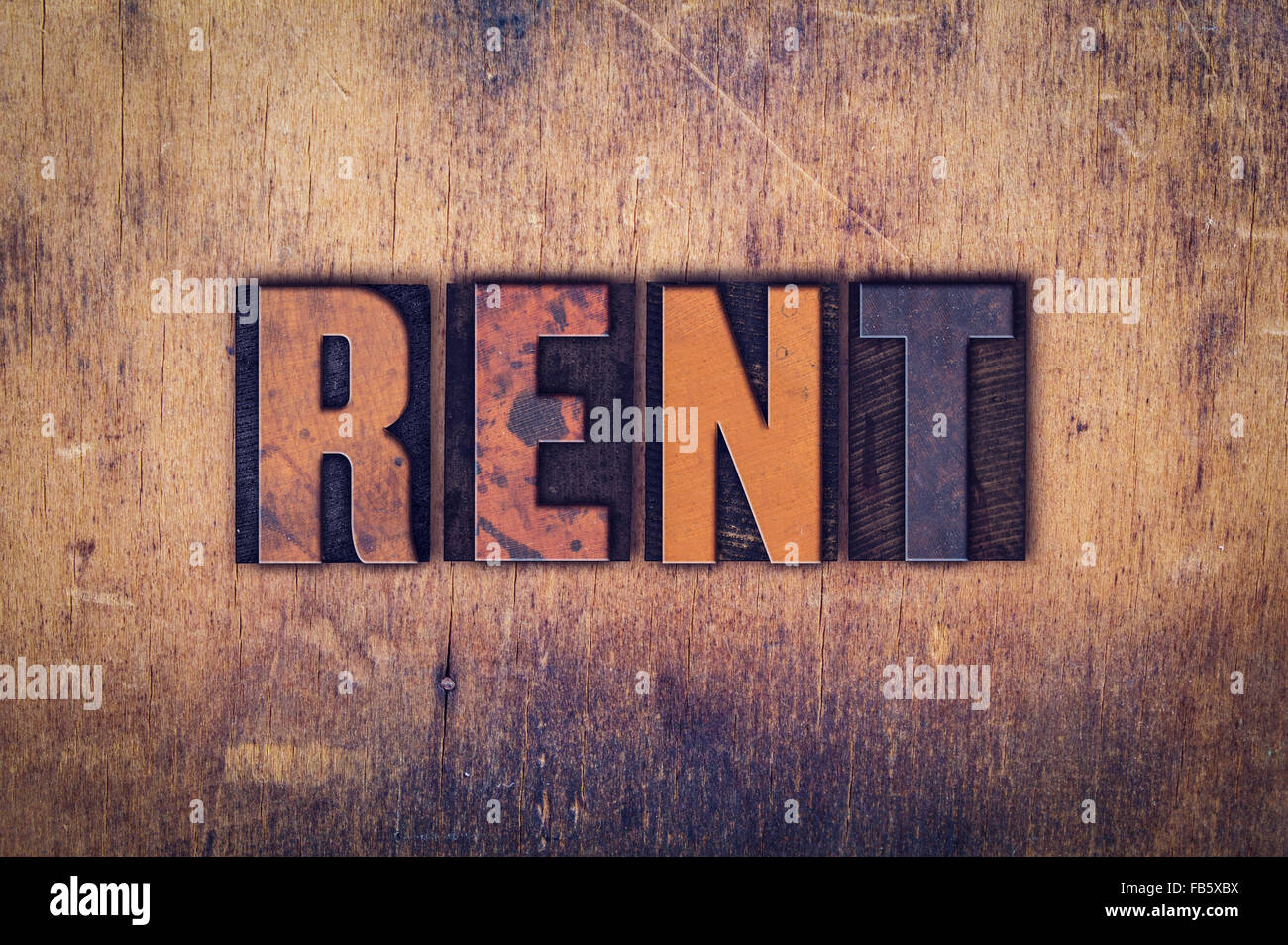 The word "Rent" written in dirty vintage letterpress type on a aged ...