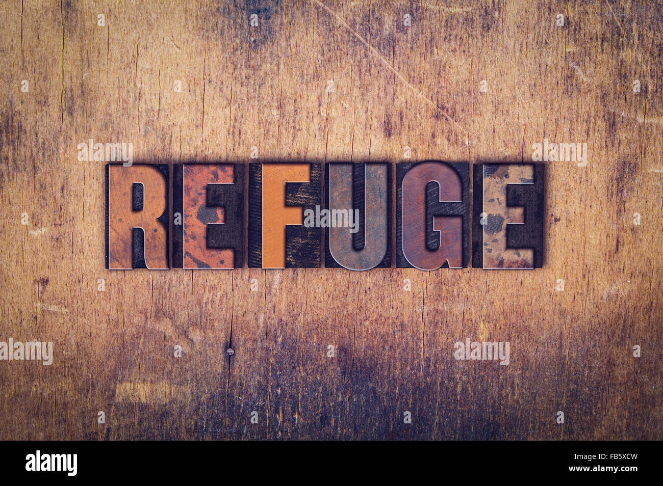 The word "Refuge" written in dirty vintage letterpress type on a aged ...