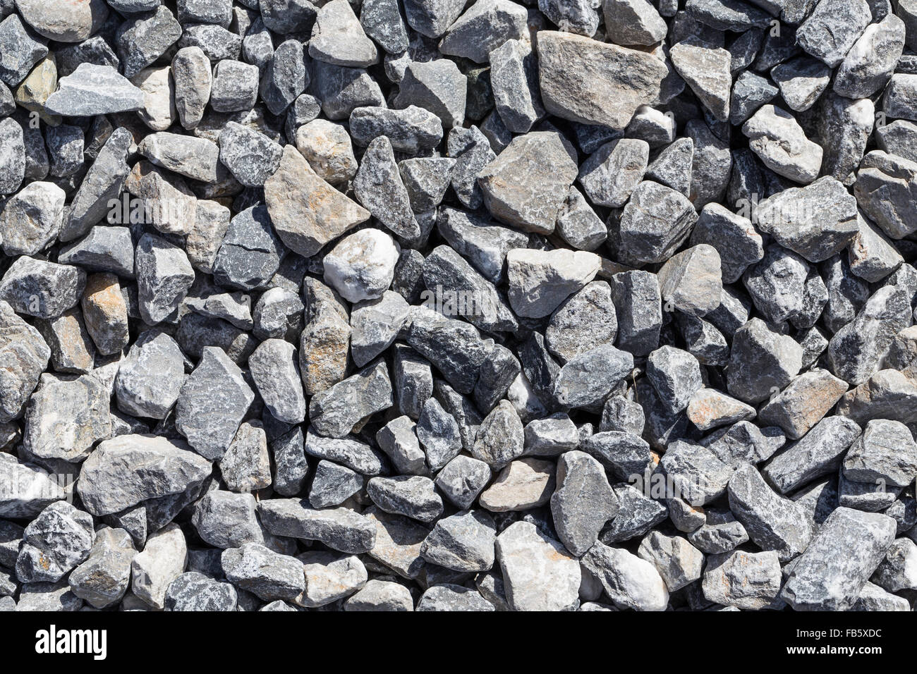 Crushed grey stone on the ground texture background Stock Photo - Alamy