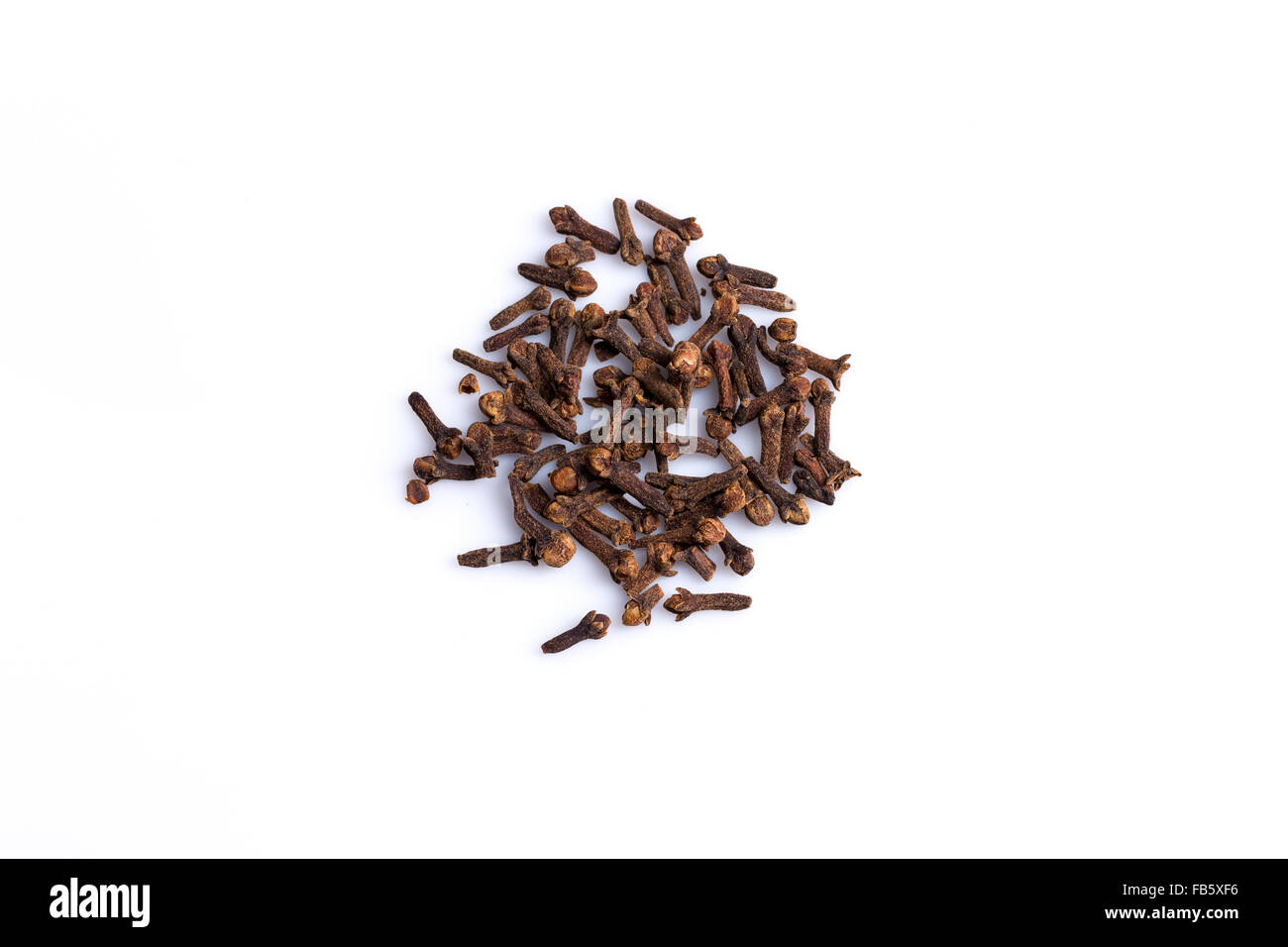 Cloves spice pile isolated on a white background Stock Photo - Alamy
