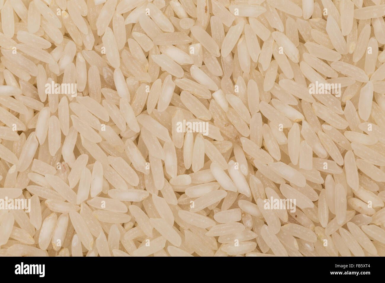 Asian white rice or uncooked white rice Stock Photo - Alamy