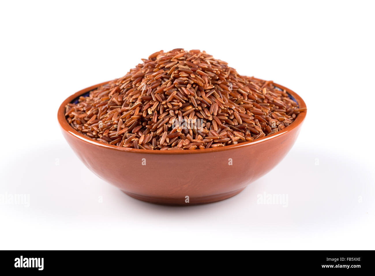 Bowl of Red Cargo Rice. Shot on white background Stock Photo - Alamy