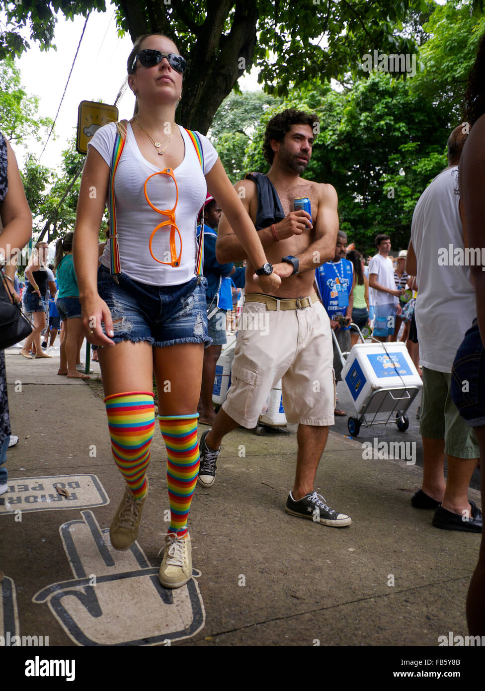 RIO DE JANEIRO, BRAZIL - CIRCA JANUARY, 2013: Young couple passes ...