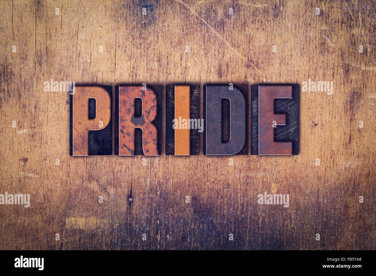 The word "Pride" written in dirty vintage letterpress type on a aged ...