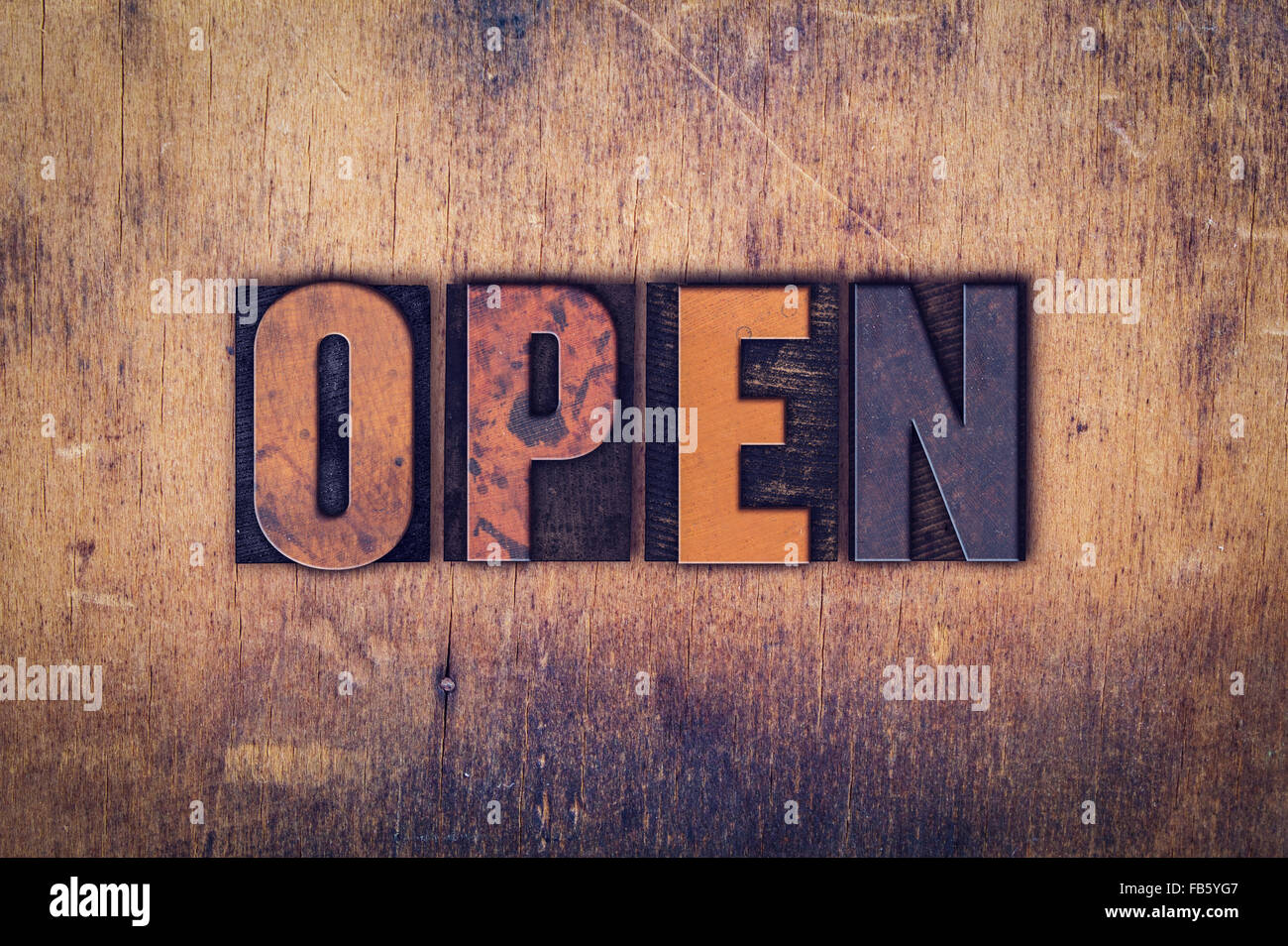 The word "Open" written in dirty vintage letterpress type on a aged ...