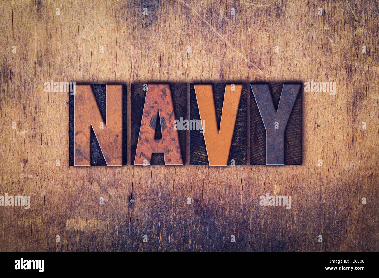 The word "Navy" written in dirty vintage letterpress type on a aged ...