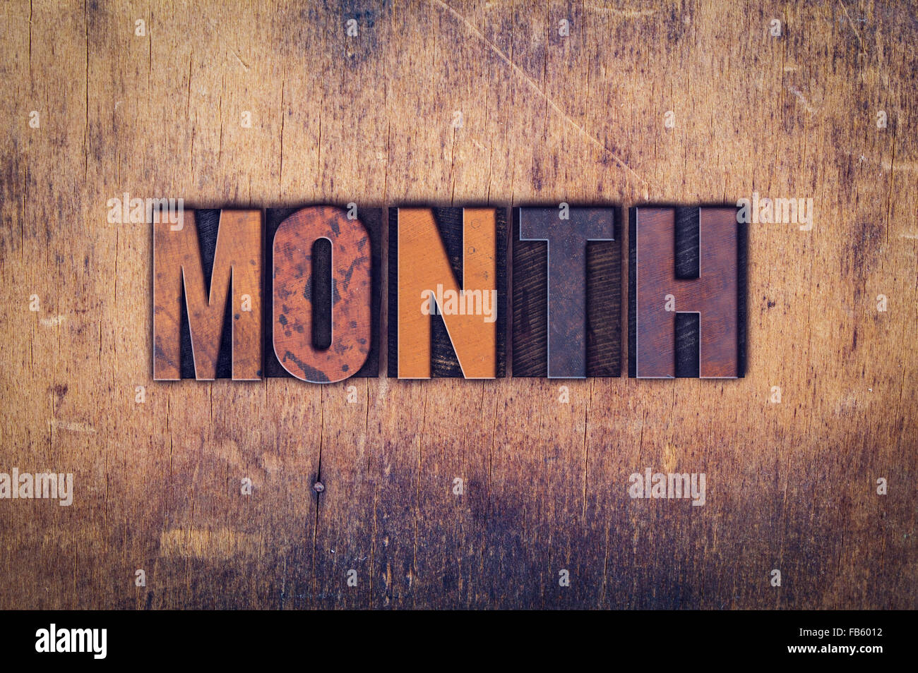 The word "Month" written in dirty vintage letterpress type on a aged ...